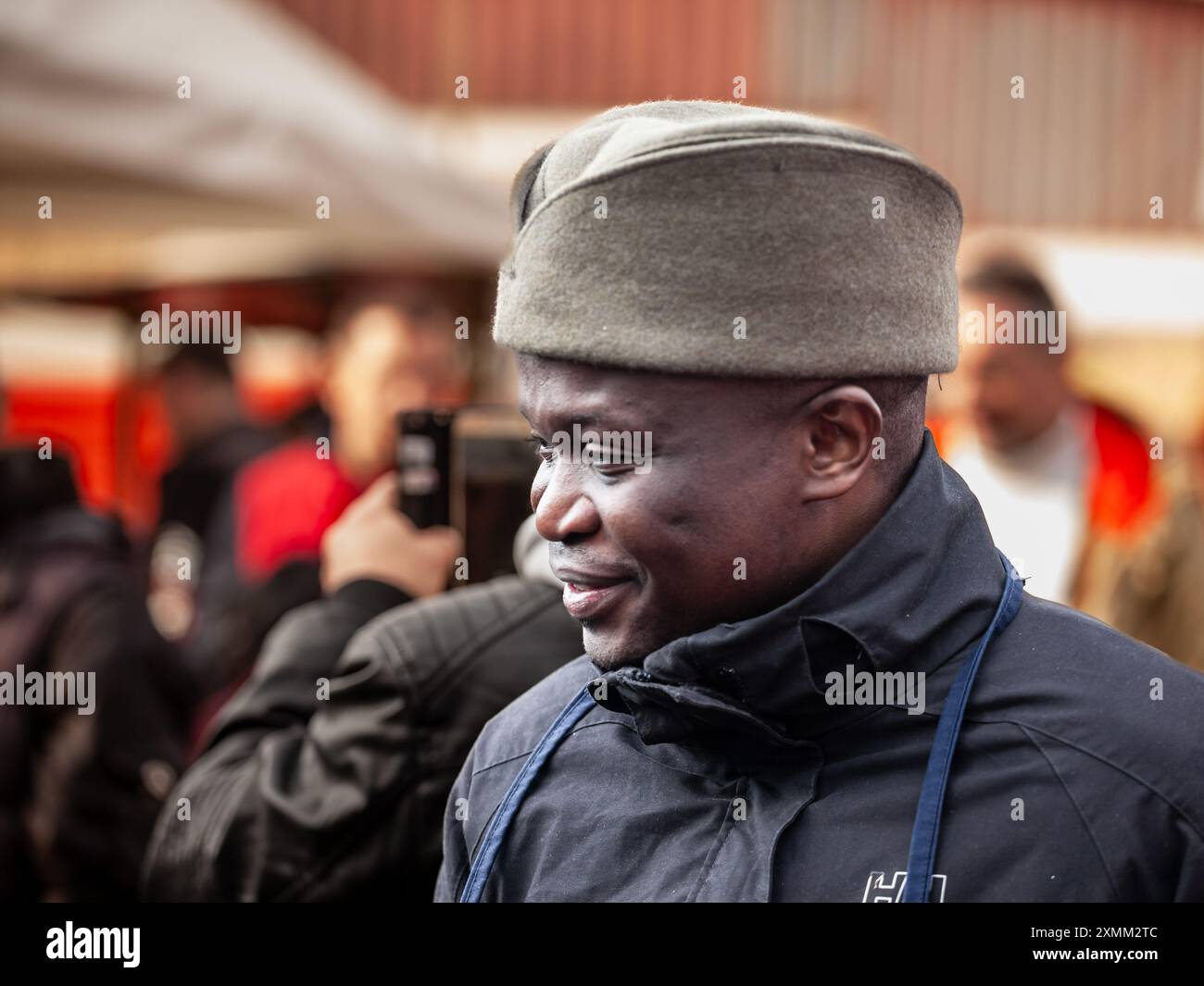 Picture of a black man standing and smiling wearing a sajkaca in ...