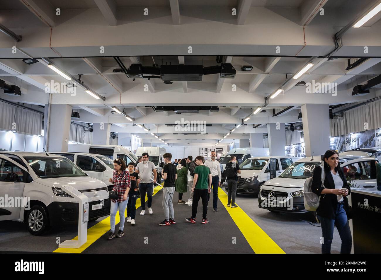 A bustling scene at a car dealership in Belgrade specializing in ...