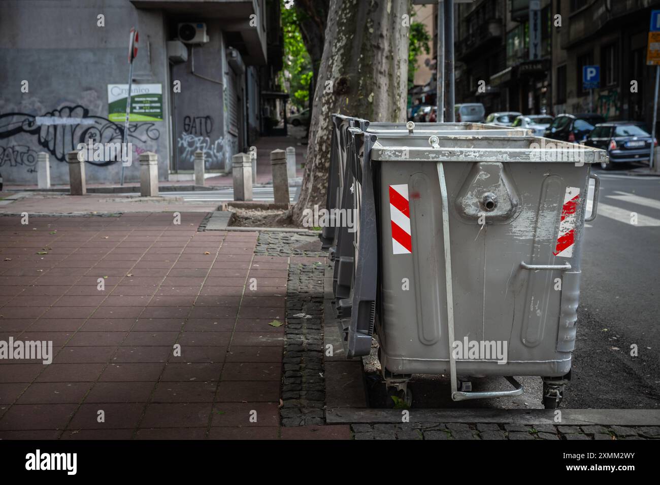This photograph depicts garbage bins located in the city center of ...