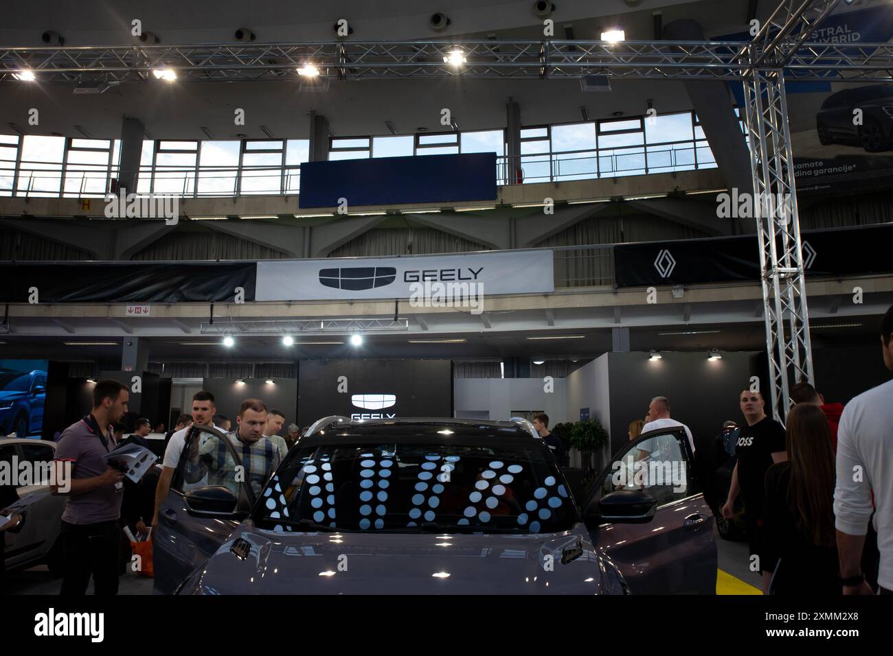 Picture of a ign with the logo in Geely on their car dealership for ...