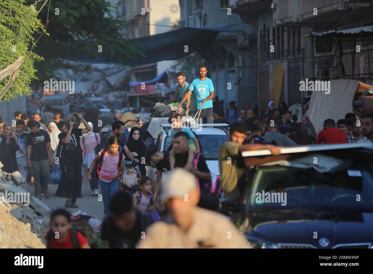 Gaza. 28th July, 2024. People flee the Bureij refugee camp in the ...