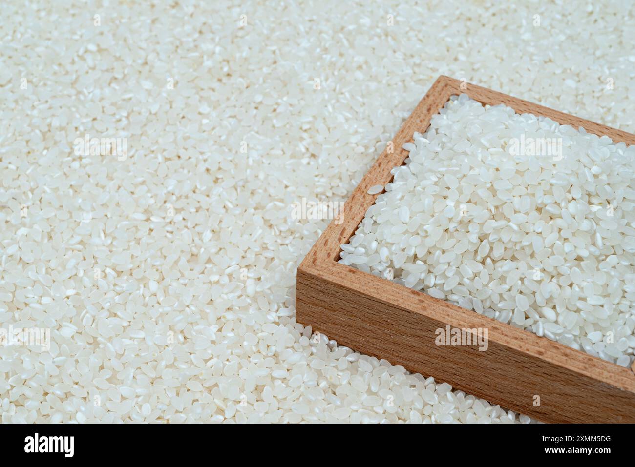 White rice on white background Stock Photo - Alamy