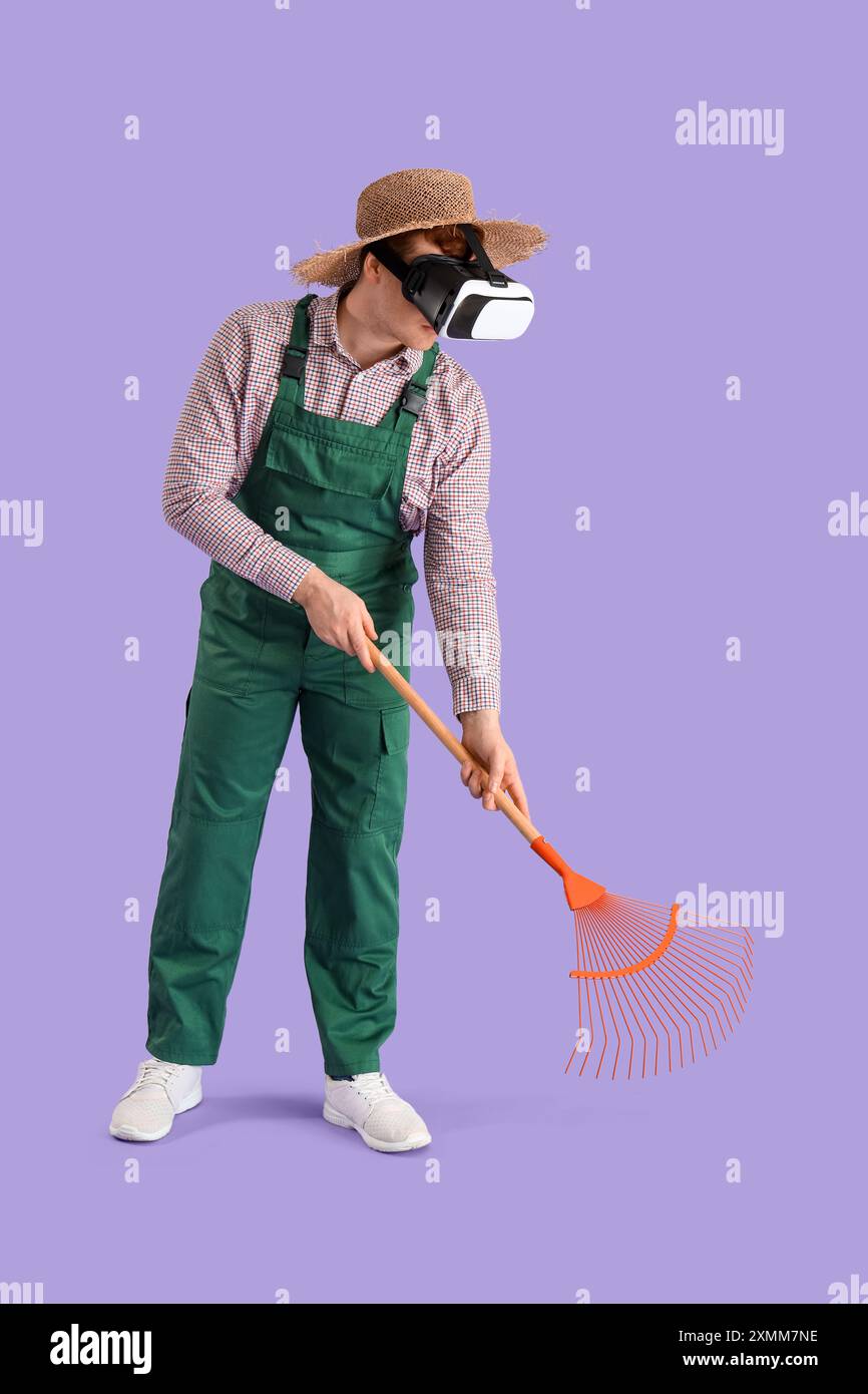 Male farmer with rake using VR glasses on lilac background Stock Photo ...