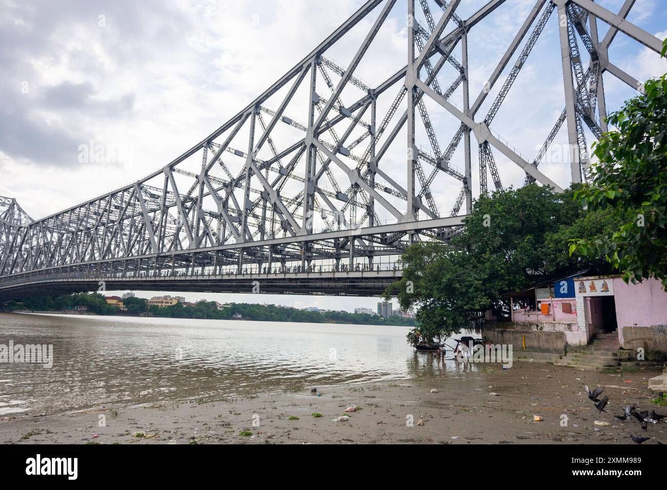An iconic landmark in Kolkata, the Howrah Bridge is a huge steel bridge ...
