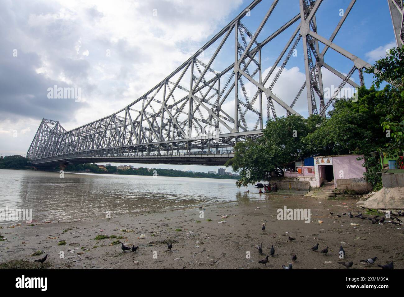 An iconic landmark in Kolkata, the Howrah Bridge is a huge steel bridge ...