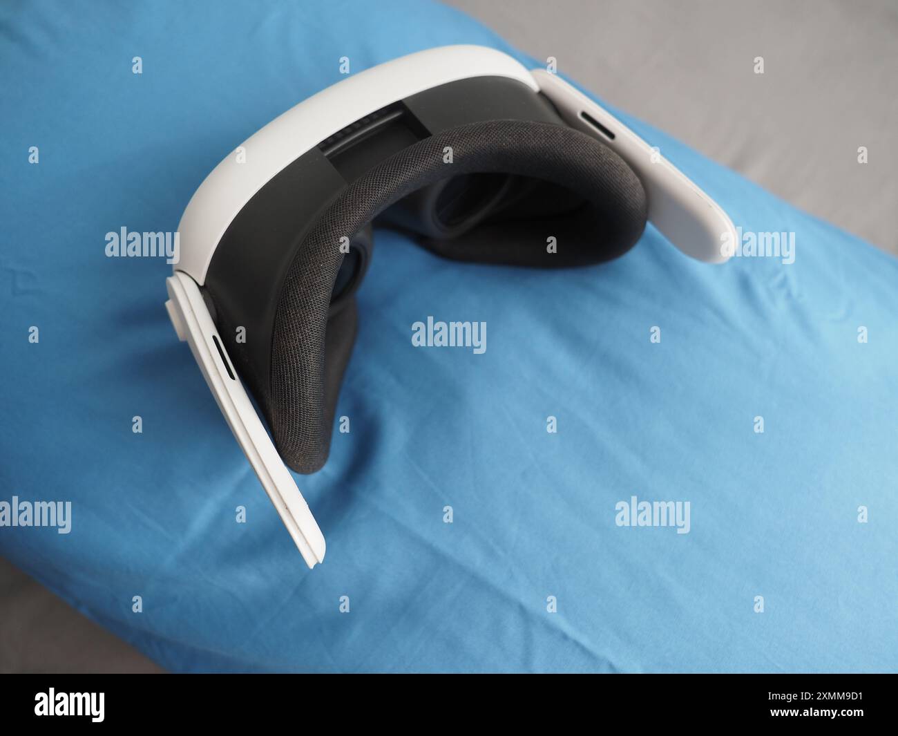 VR headset on pillow. Interacting with Augmented Reality lying on bed ...