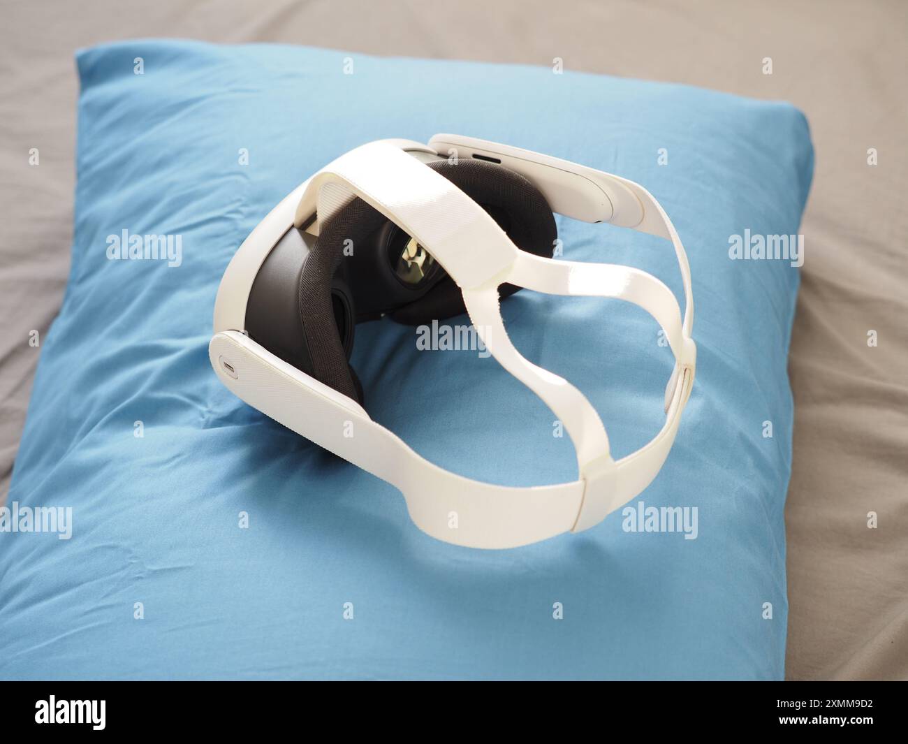 VR headset on pillow. Interacting with Augmented Reality lying on bed ...