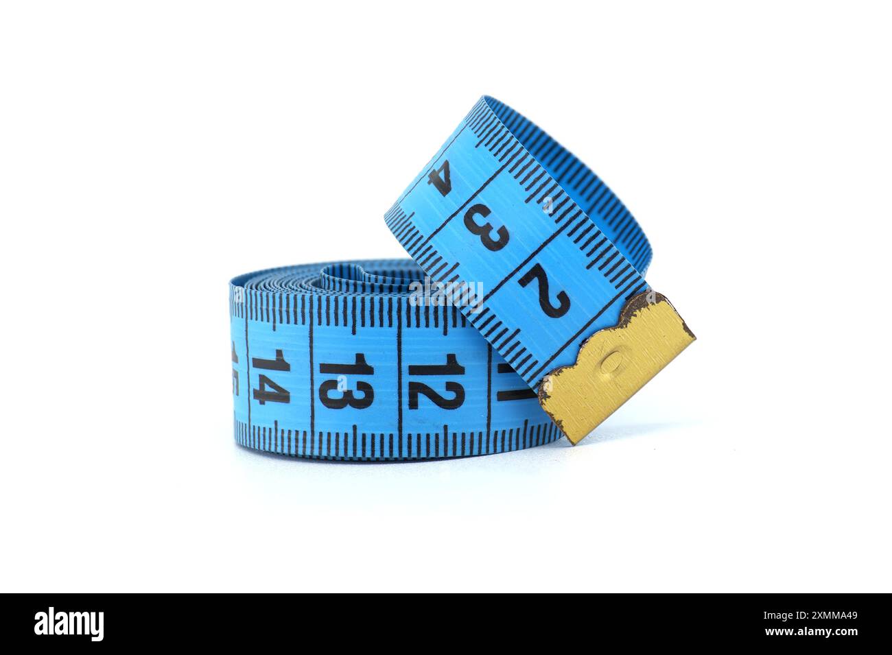 Close-up photo of a blue measuring tape neatly rolled up against a ...