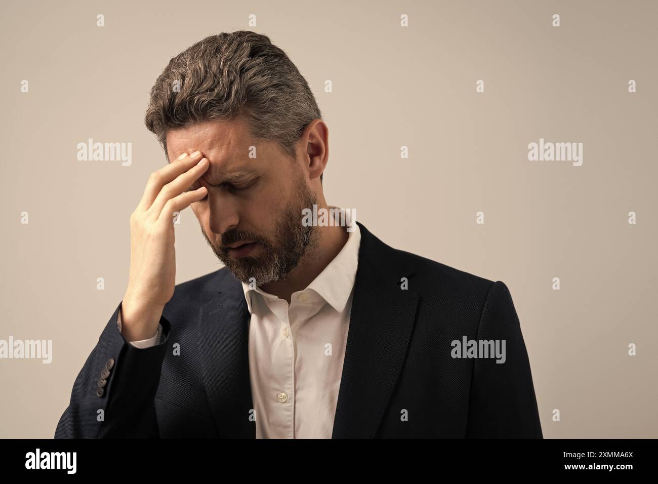 Overworked man business manager. Overworked man feeling migraine head ...