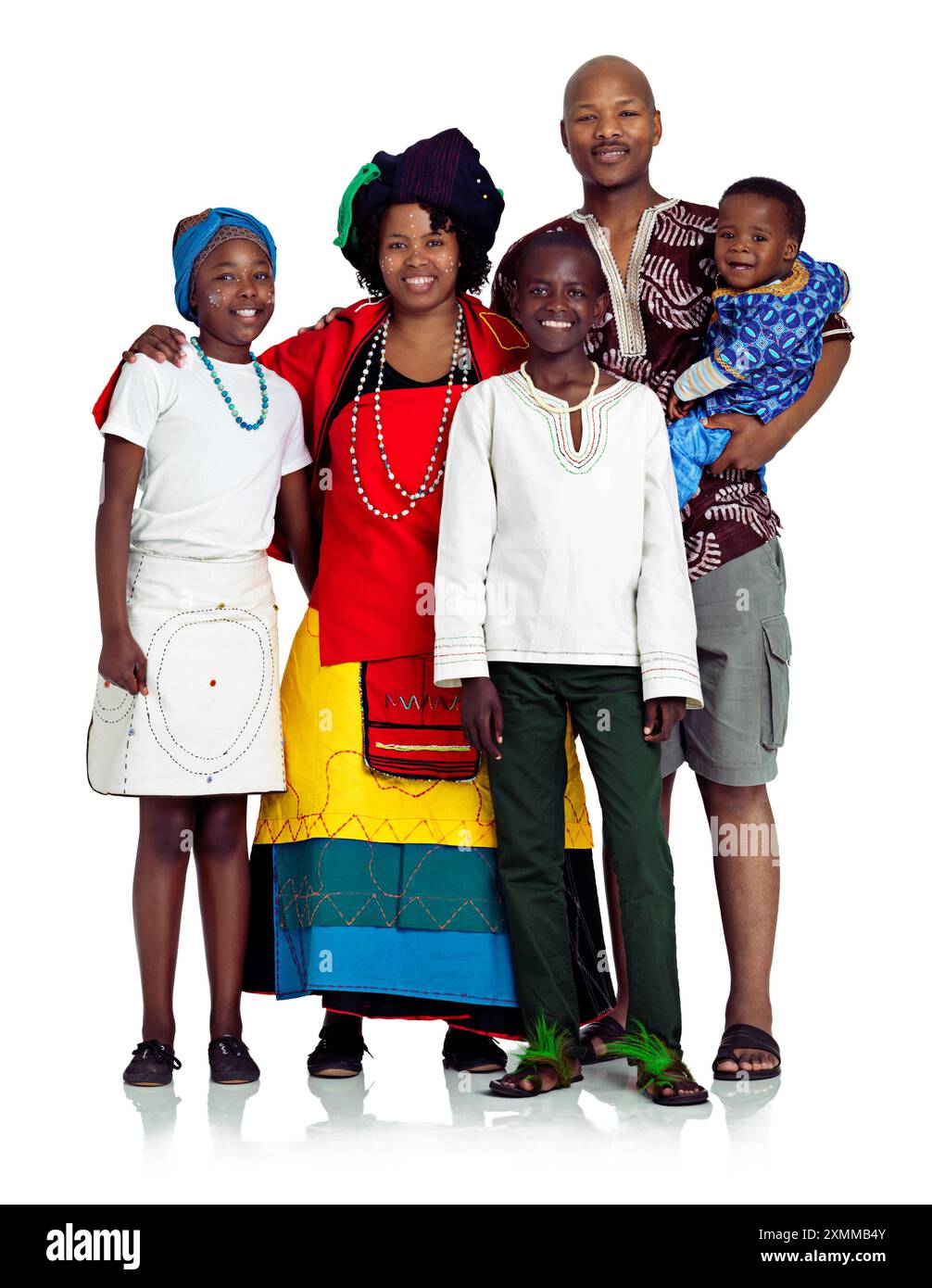 Traditional, portrait and African parents with kids in studio with ...