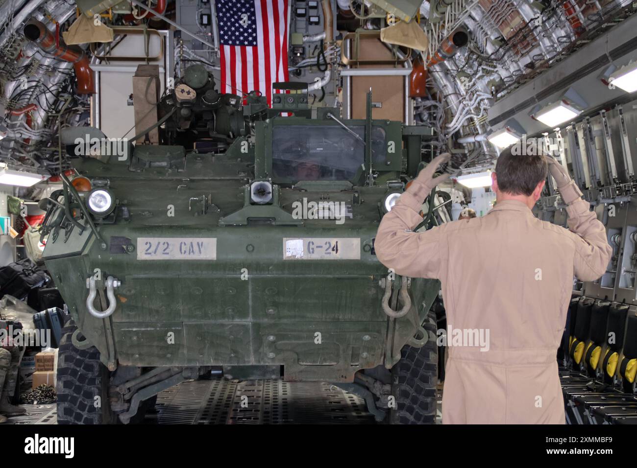 A crew member from the Heavy Airlift Wing (HAW) of the Strategic ...