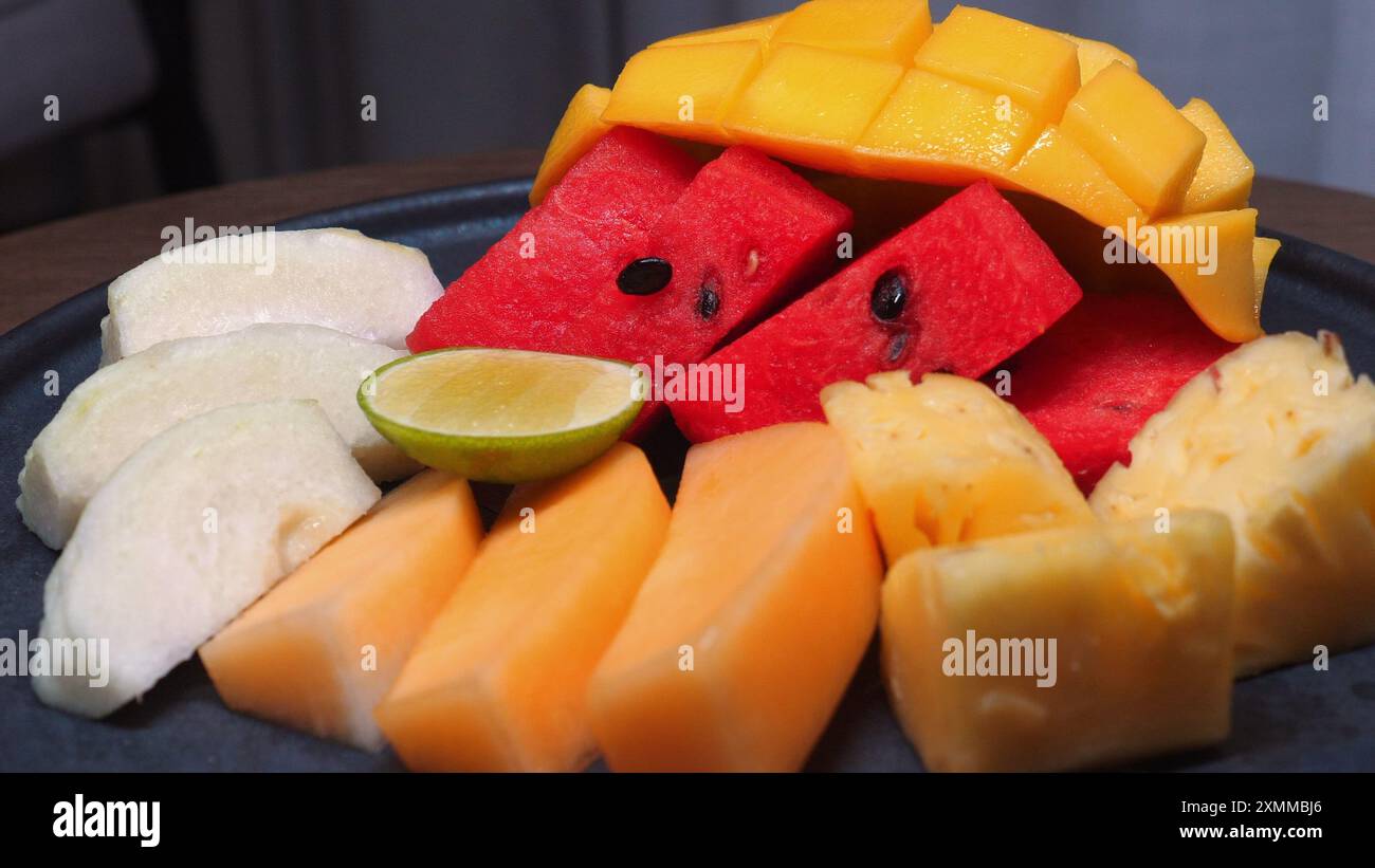Assorted tropical fruits including mango hi-res stock photography and ...