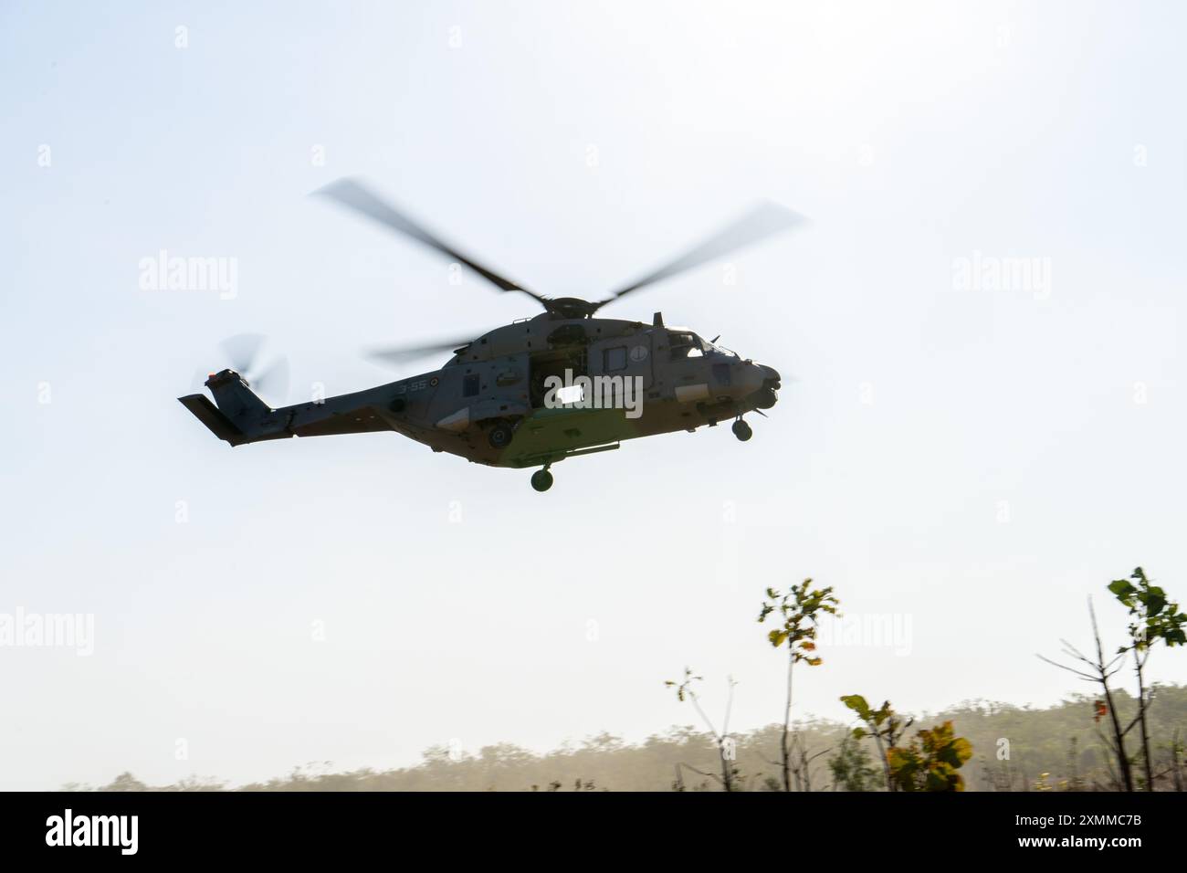 Italian Navy pilots prepare to land an NH90 helicopter for a bi-lateral ...