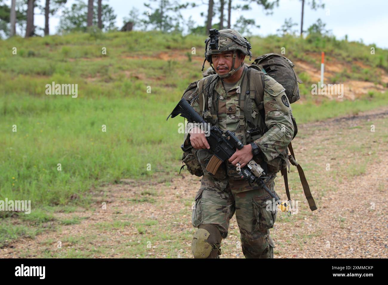 A Soldier from the Guam Army National Guard, conduct a tactical foot ...