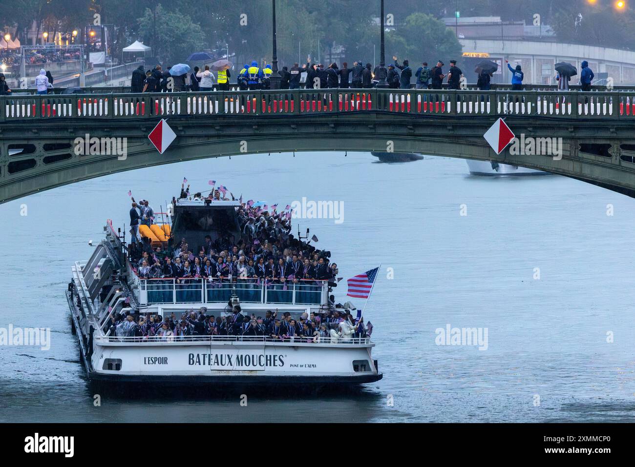 The U.S. Olympic Team waves to onlookers during the opening ceremonies ...