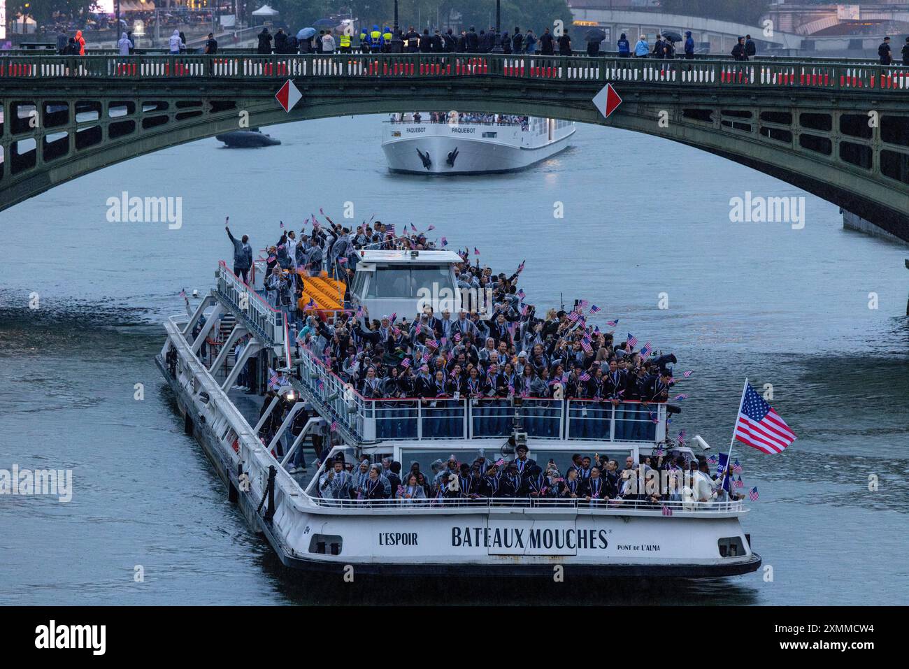 The U.S. Olympic Team waves to onlookers during the opening ceremonies ...