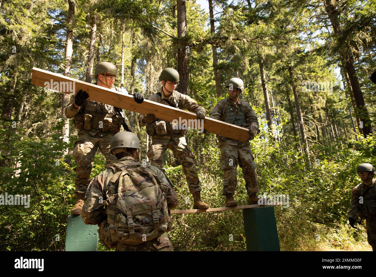 U.S. Army Officer Candidates navigate an obstacle at the Field ...