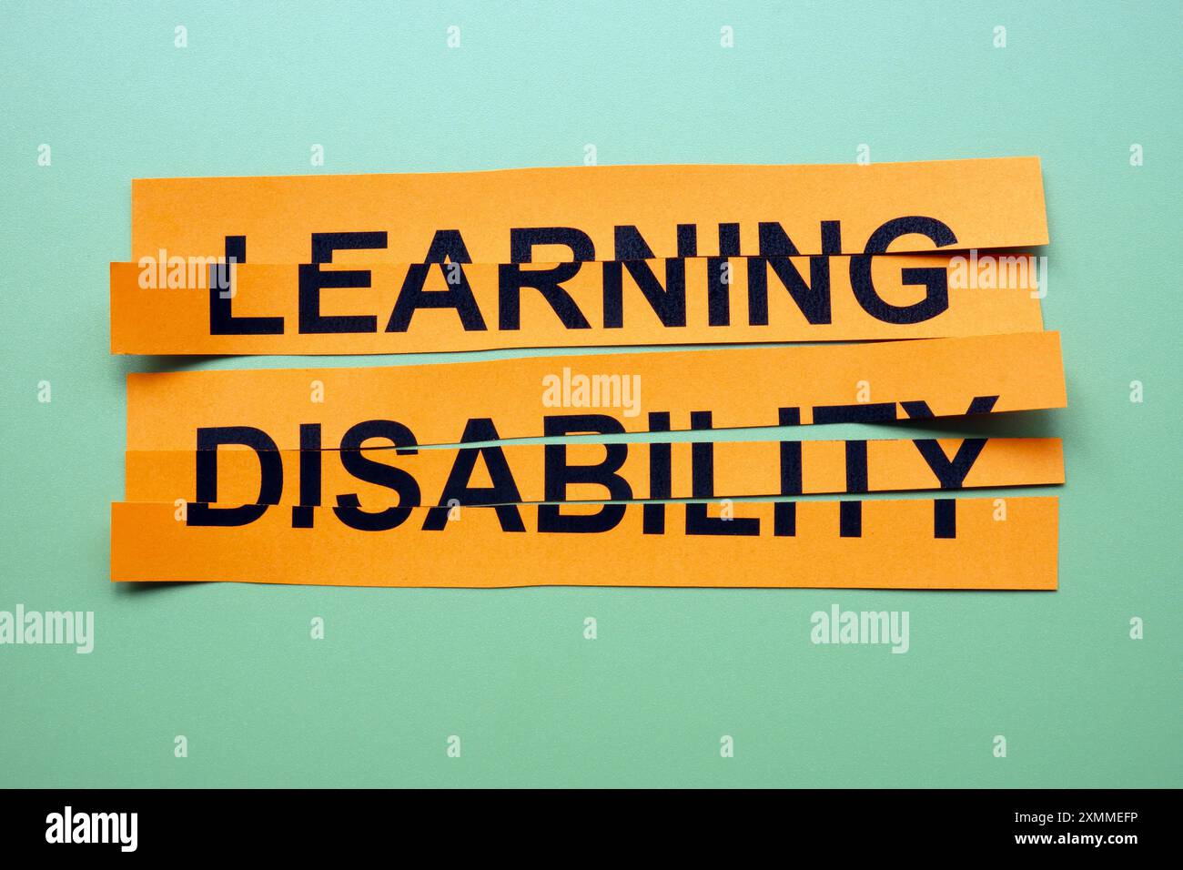 Cut pieces of paper with writing Learning disability Stock Photo - Alamy