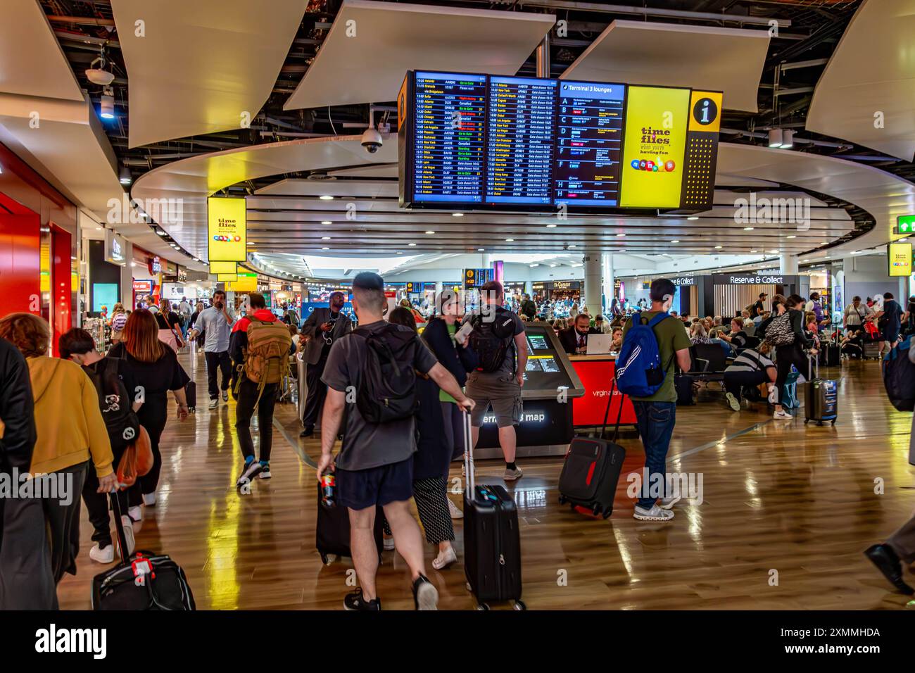 Electronic departure boards in the departure lounge at London Heathrow ...