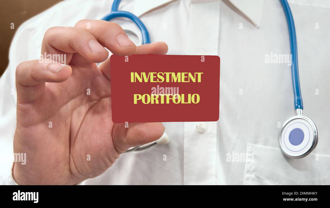 INVESTMENT PORTFOLIO words written on a red business card, a card in a ...