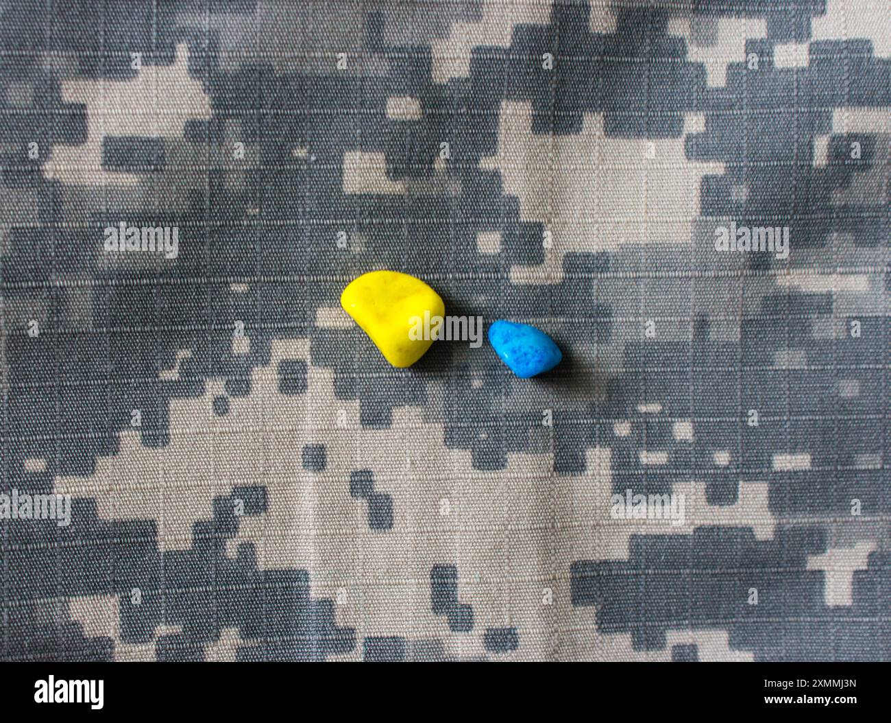 Yellow and blue stones on pixel background. Symbol of Ukrainian ...