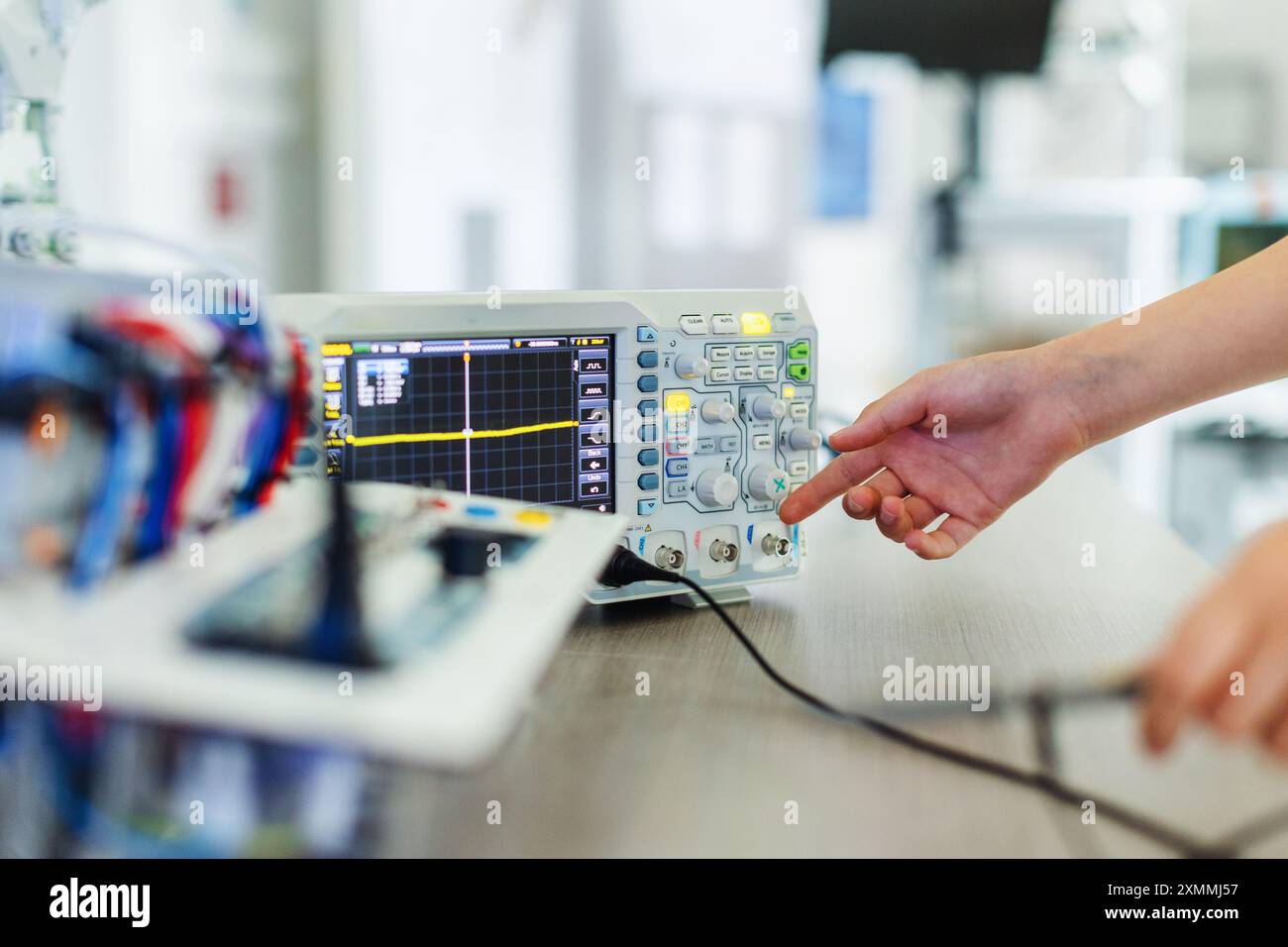 Working on circuit board, building robot in after-school robotics club ...