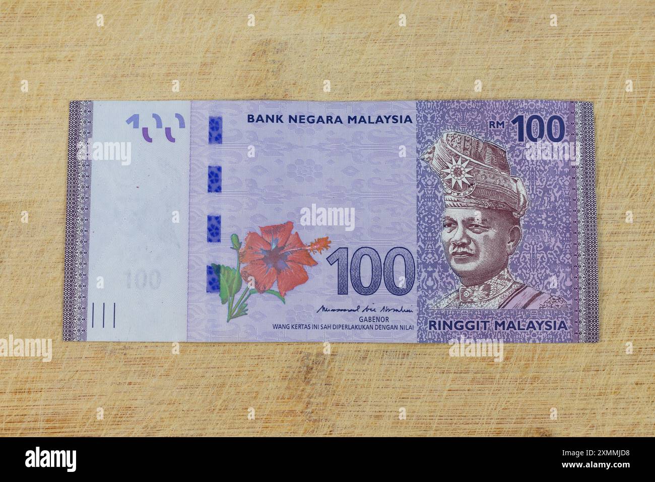 The purple and brown coloured RM100 banknote features Abdul Rahman on a ...