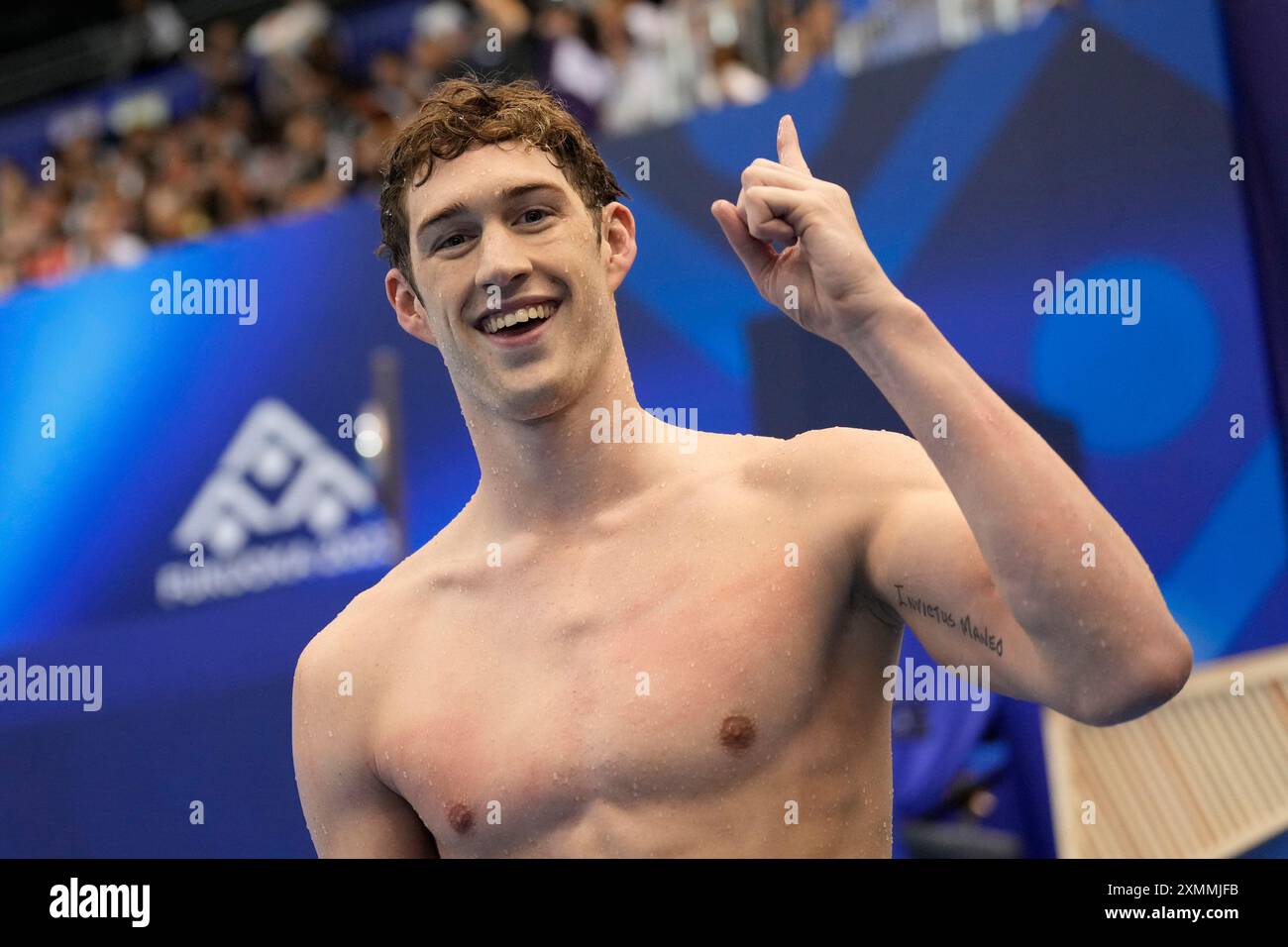 FILE - Hunter Armstrong of the U.S. celebrates after winning the men's ...