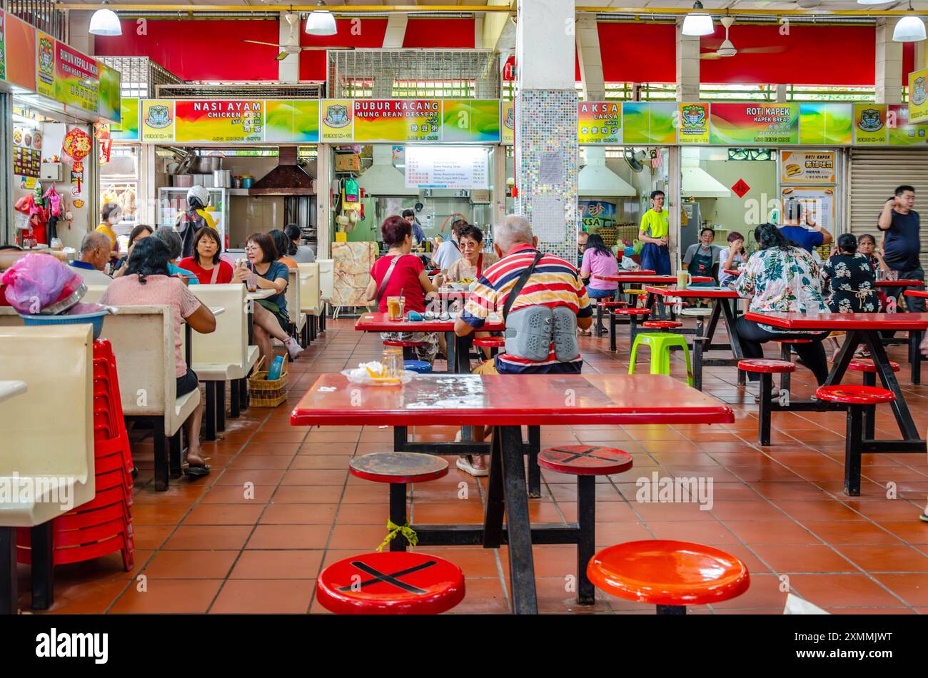 People eating breakfast at the food court in Tanjung Bungah Market in ...