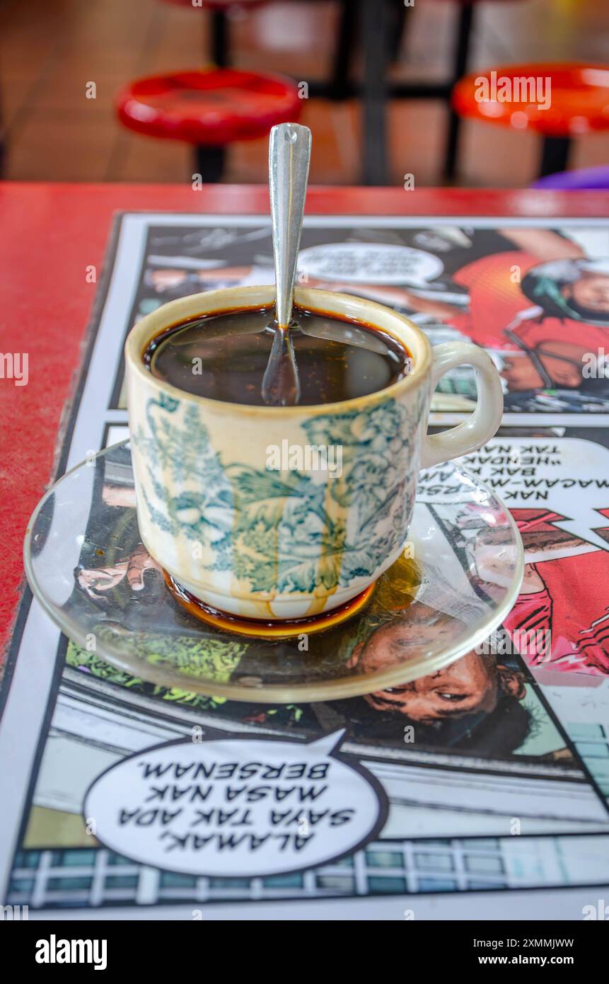 A cup of coffee ordered from the food court at Tanjung Bungah market in ...