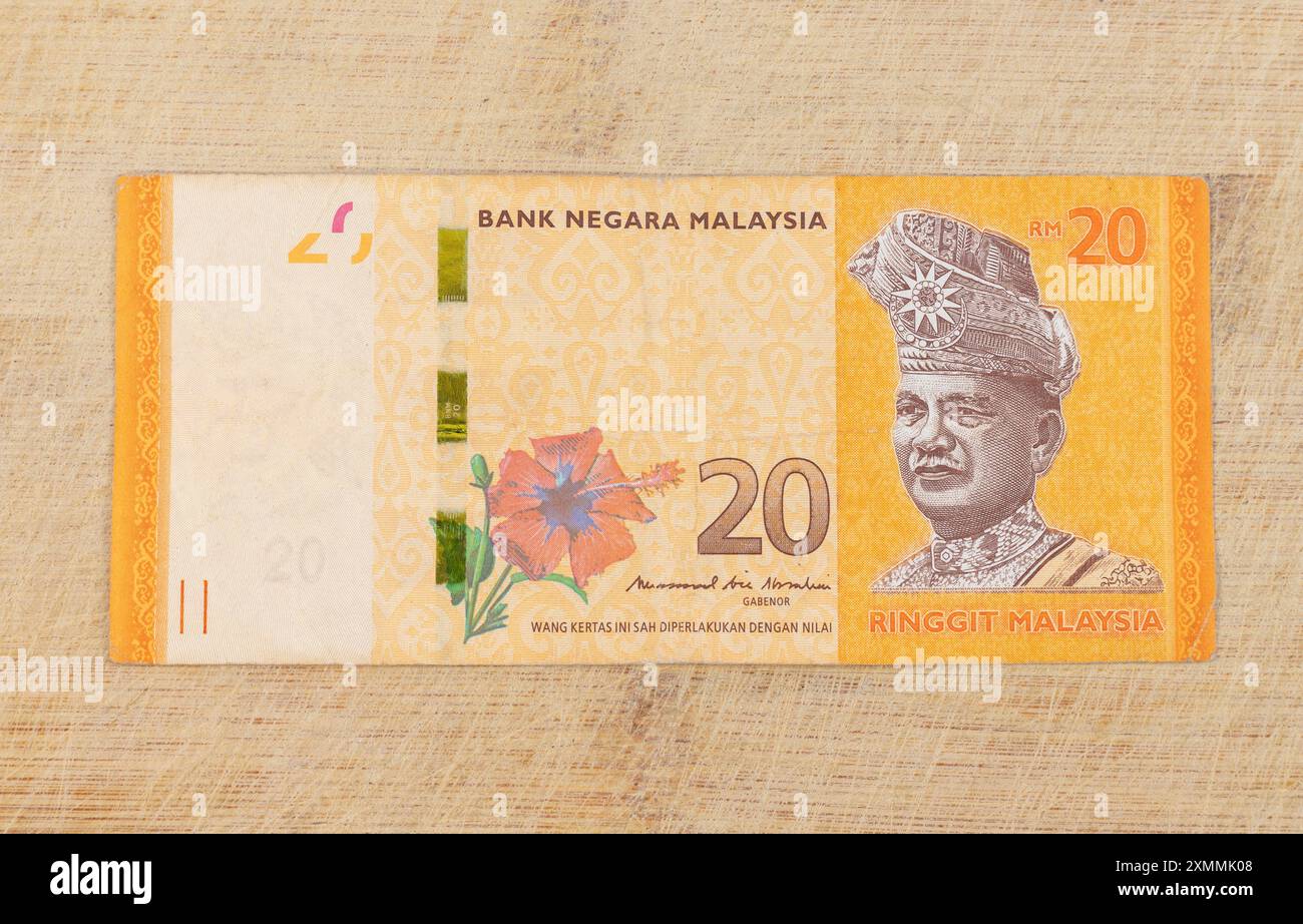 Malaysia twenty ringgit banknote on a wooden background Stock Photo - Alamy