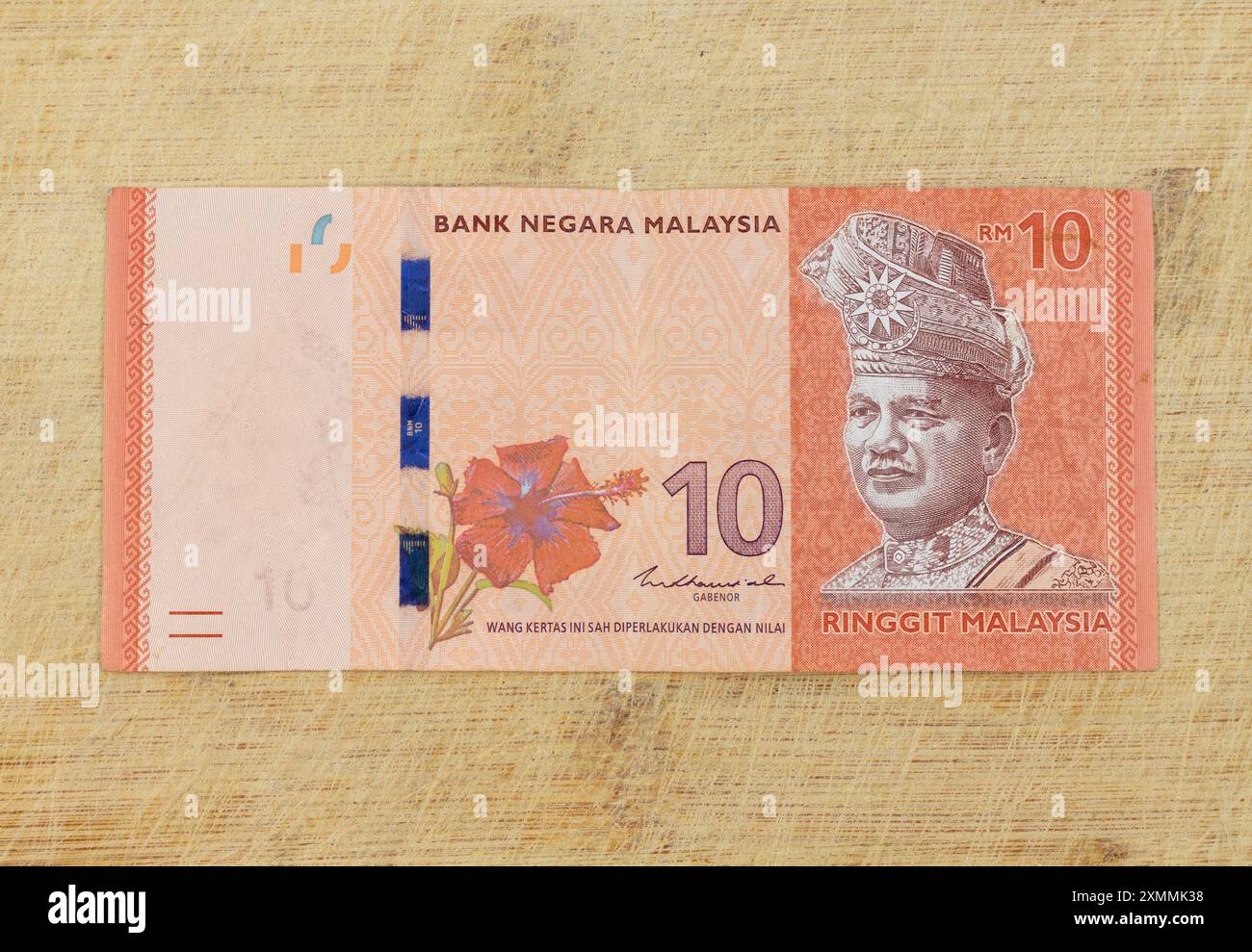 Malaysian 10 Ringgit banknote on a wooden background Stock Photo - Alamy