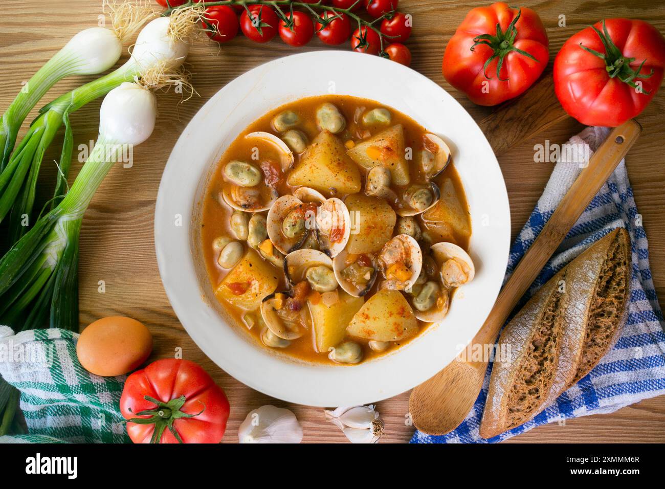 Clam stew with potatoes and beans. Traditional Spanish recipe Stock ...