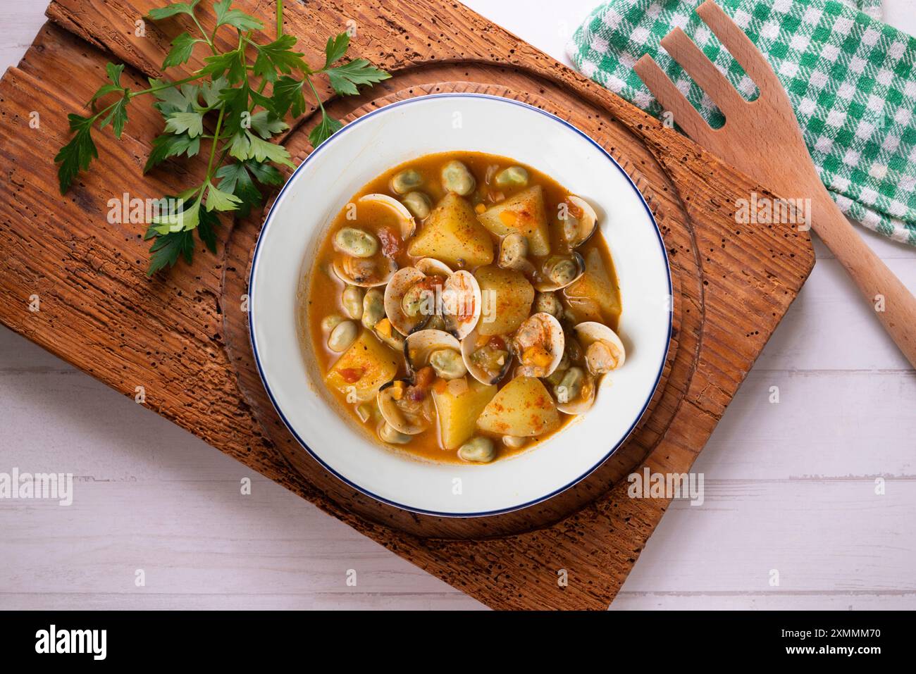 Clam stew with potatoes and beans. Traditional Spanish recipe Stock ...