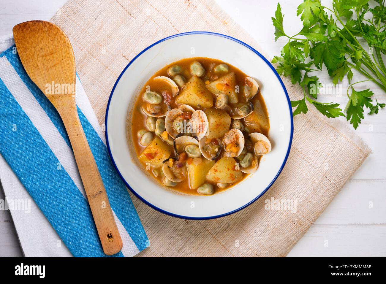 Clam stew with potatoes and beans. Traditional Spanish recipe Stock ...