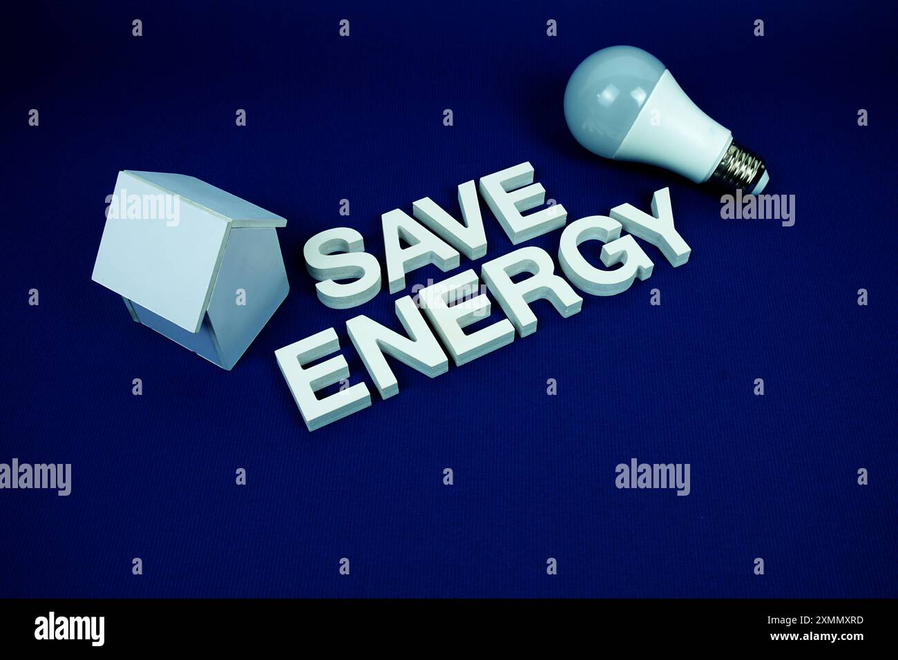 Save Energy alphabet letters with house model and LED light bulbs on ...