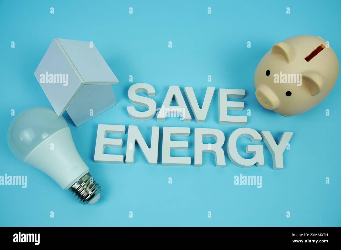 Save Energy alphabet letters with house model, piggy bank and LED light ...