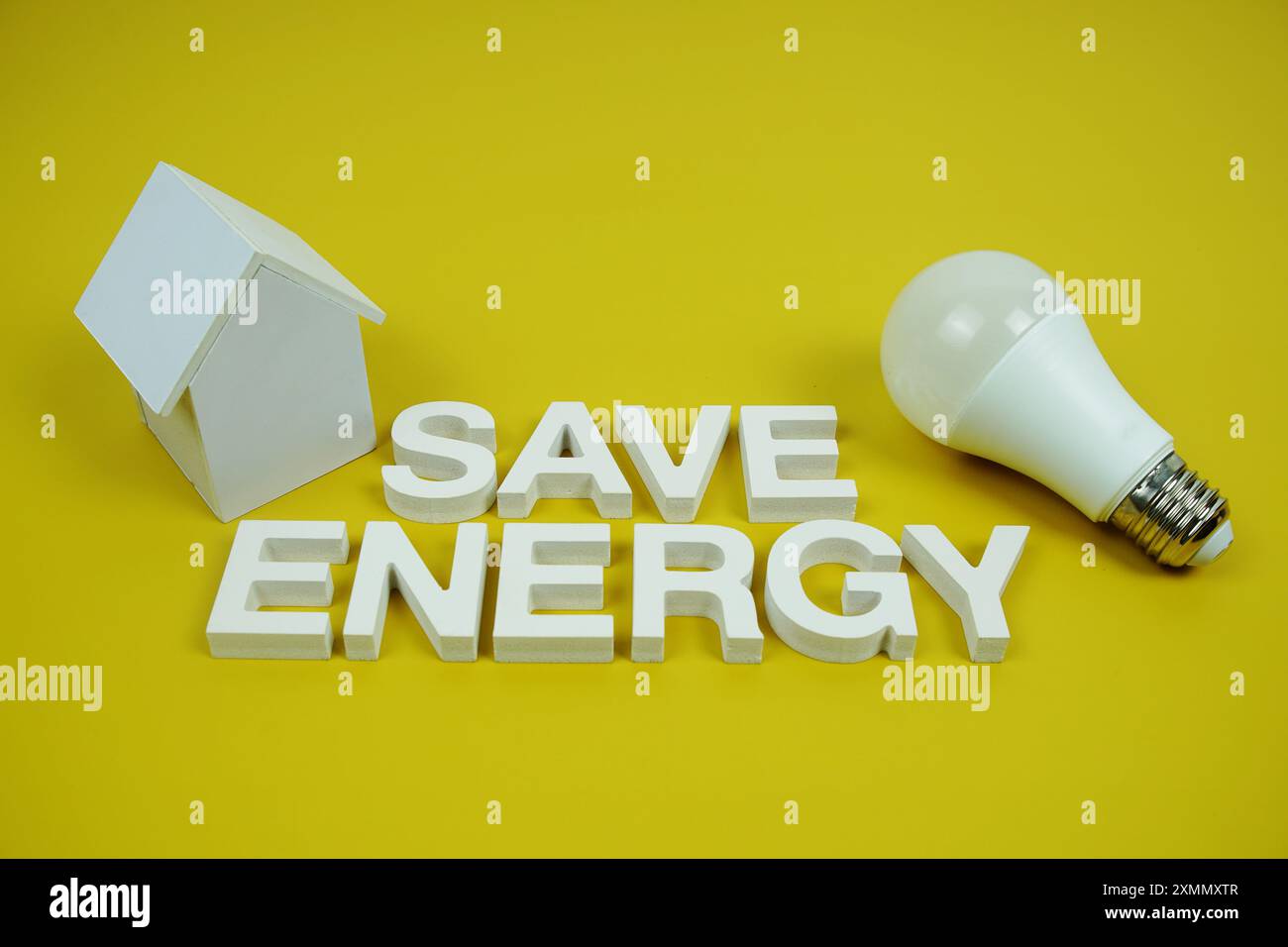 Save Energy alphabet letters with house model and LED light bulbs on ...