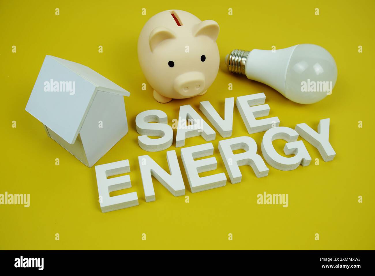 Save Energy alphabet letters with house model, piggy bank and LED light ...