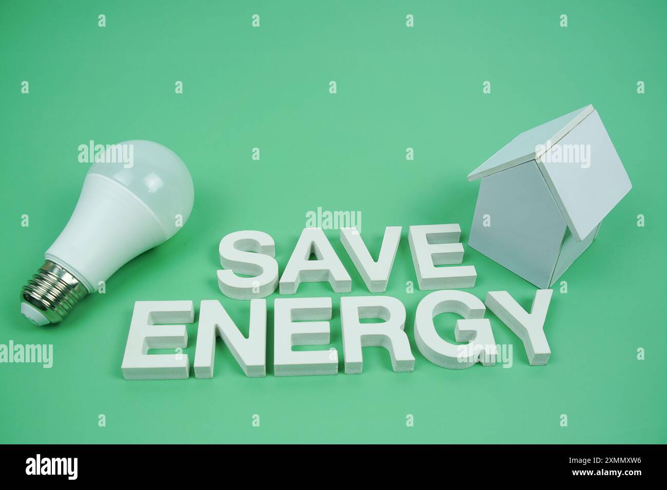 Save Energy alphabet letters with house model and LED light bulbs on ...