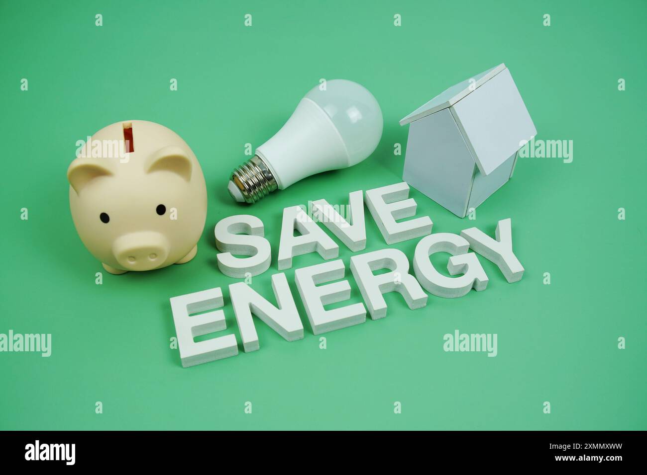 Save Energy alphabet letters with house model, piggy bank and LED light ...
