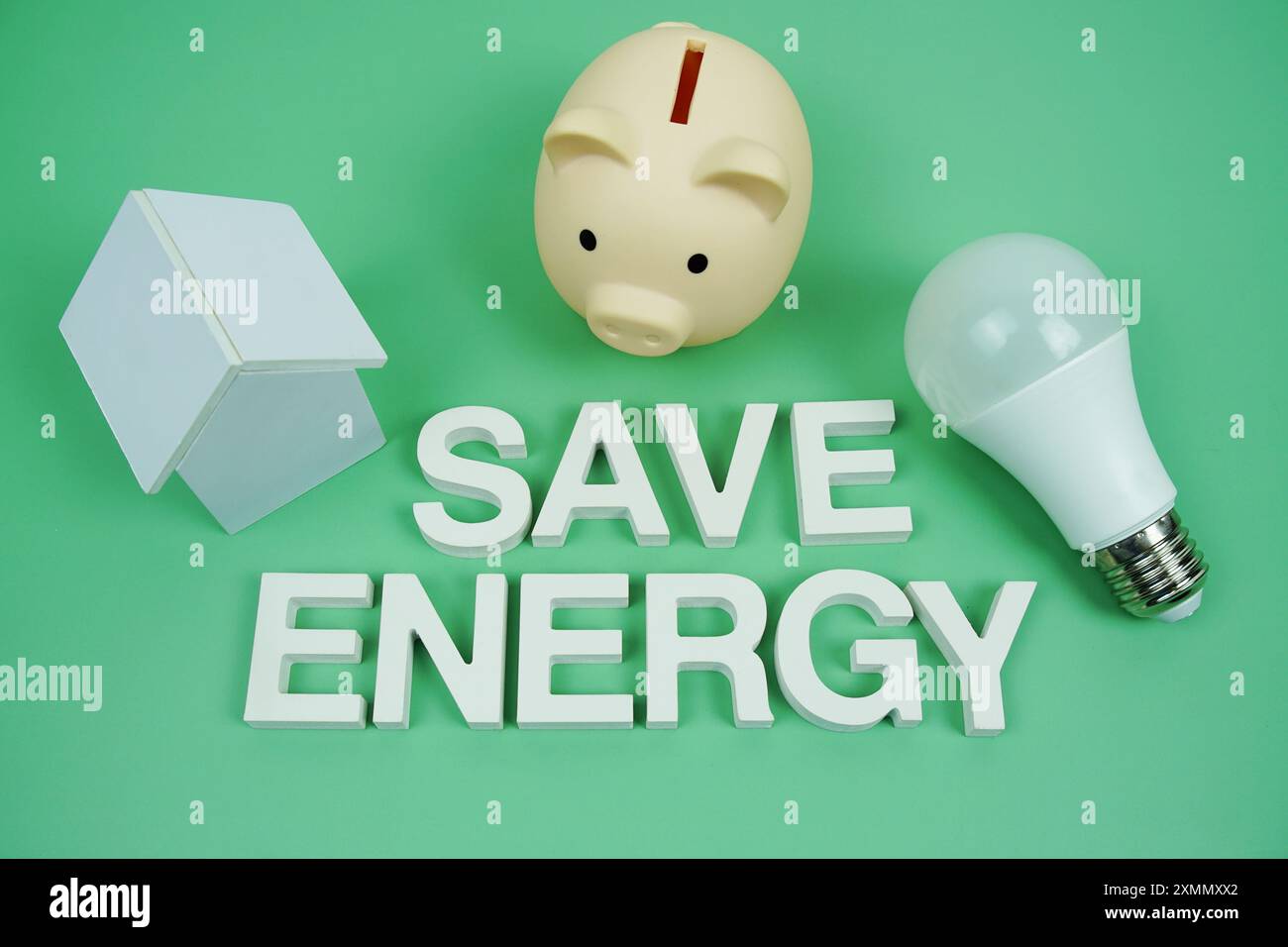 Save Energy alphabet letters with house model, piggy bank and LED light ...