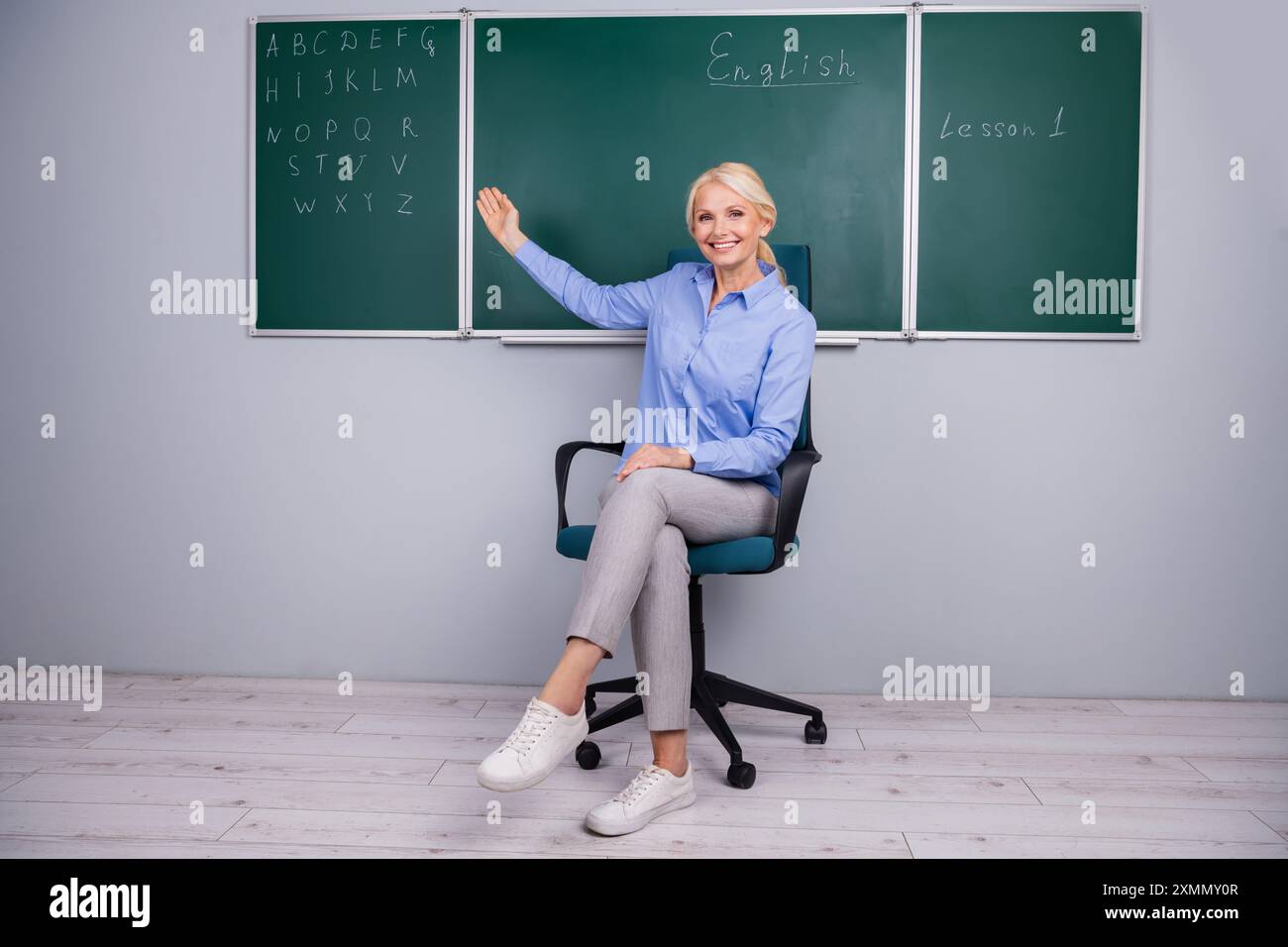 Photo of adorable charming senior woman school teacher conduct lesson ...