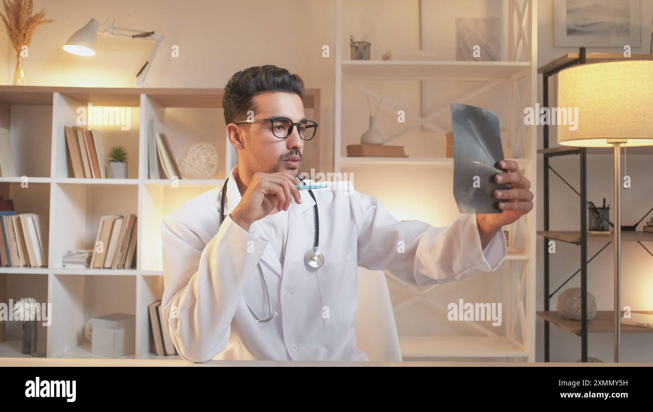 Clinical diagnosis. Traumatologist doctor. Smart surgeon man in white ...