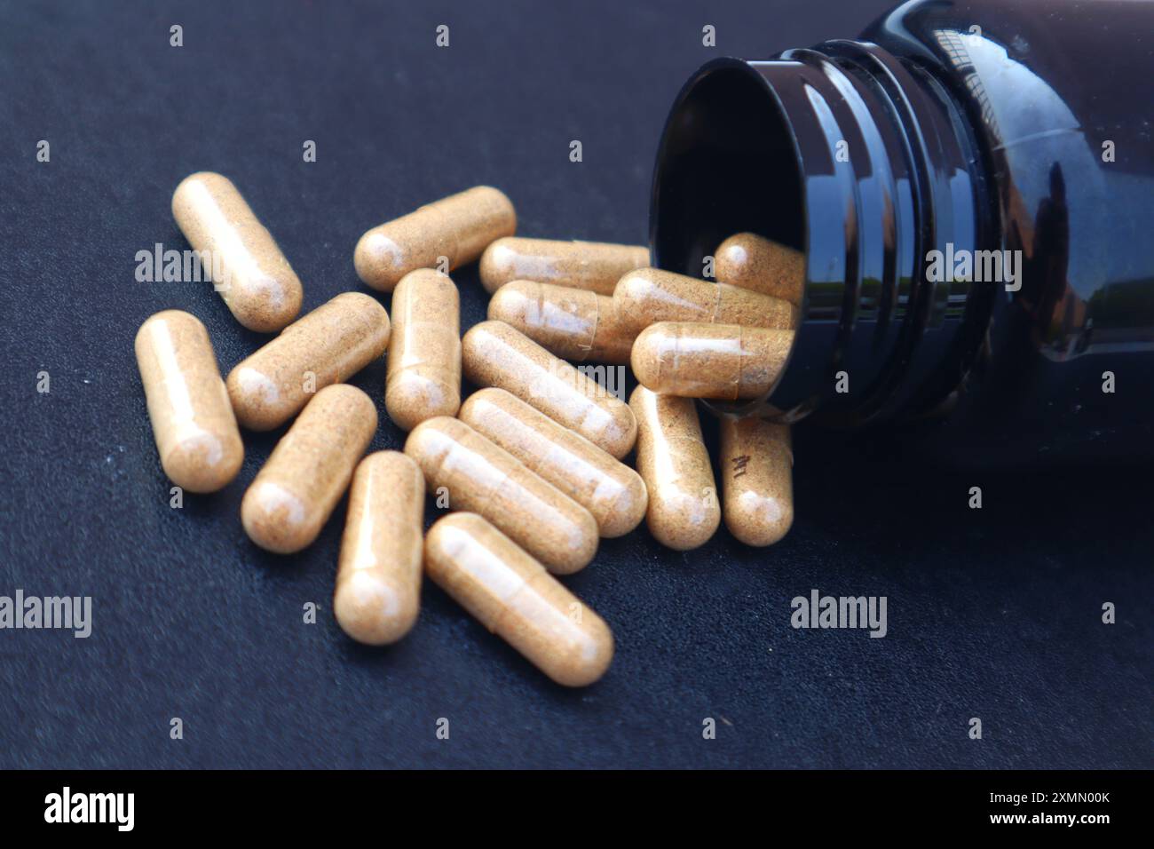 Antibiotic pills falling from bottle hi-res stock photography and ...