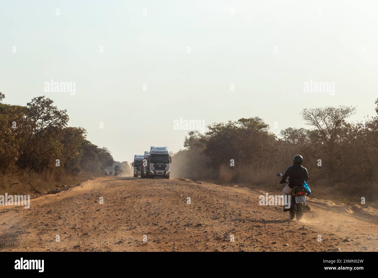The Great North Road in Zambia - motor bike heading down a rocky ...