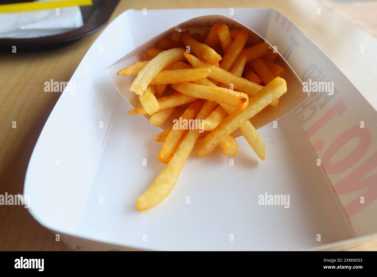 French fries in a cardboard container ready to eat Stock Photo - Alamy
