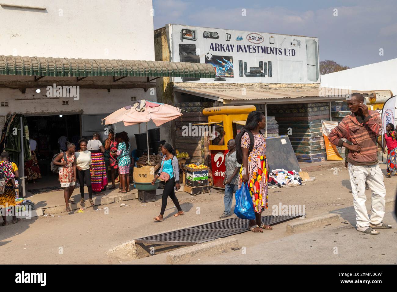 Street scene showing shoppers in Kabwe at a store selling everyday ...