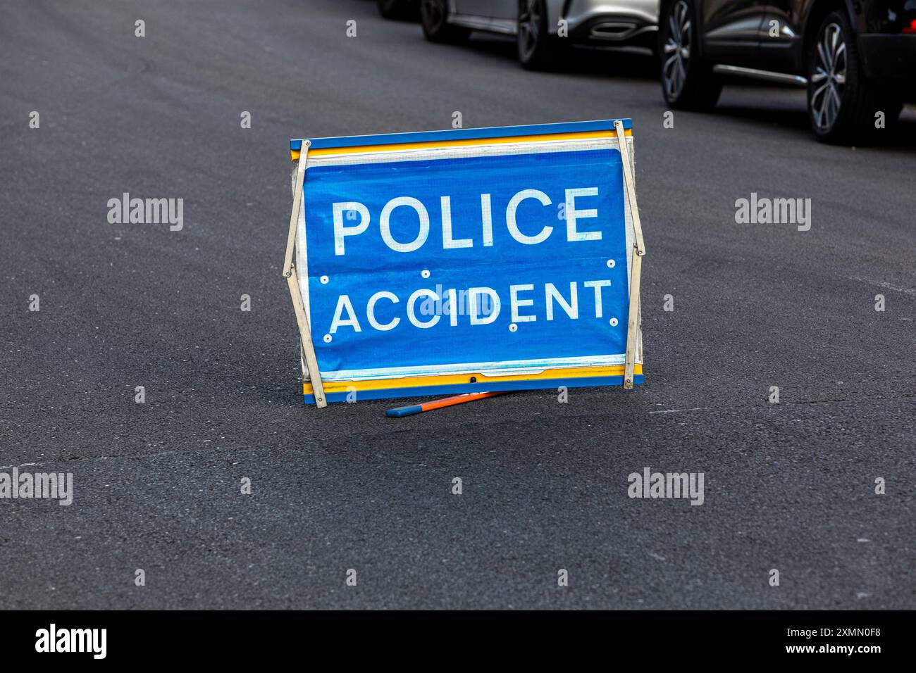 A police accident sign in a road Stock Photo - Alamy