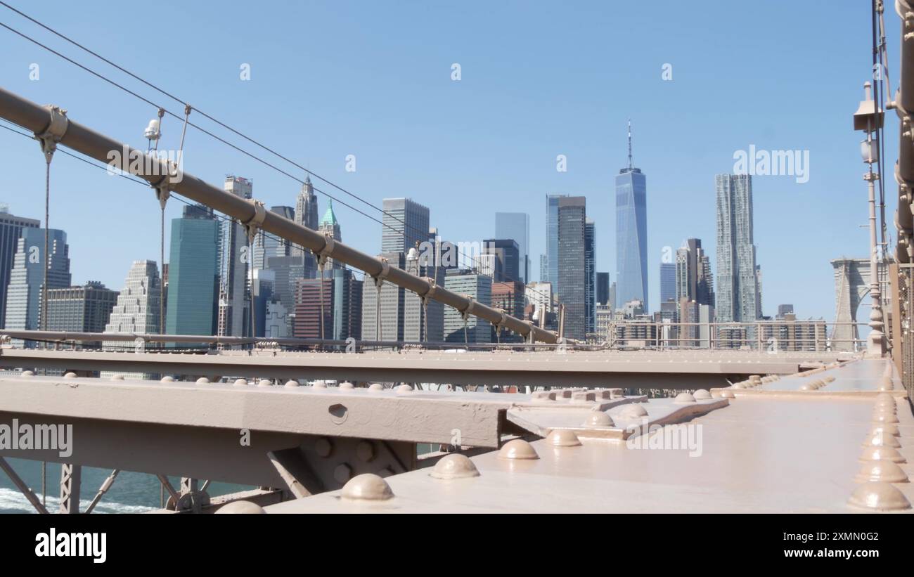 Brooklyn Bridge to Manhattan downtown. New York City skyline, financial ...